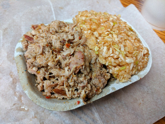 Barbecue served exactly as nature intended: a generous pile of chopped smoky goodness alongside that signature reddish slaw.