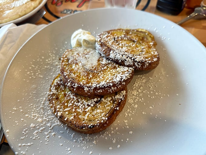 French toast that's had a cinnamon swirl makeover, dusted with powdered sugar and topped with fresh bananas&mdash;breakfast or dessert? The line deliciously blurs.