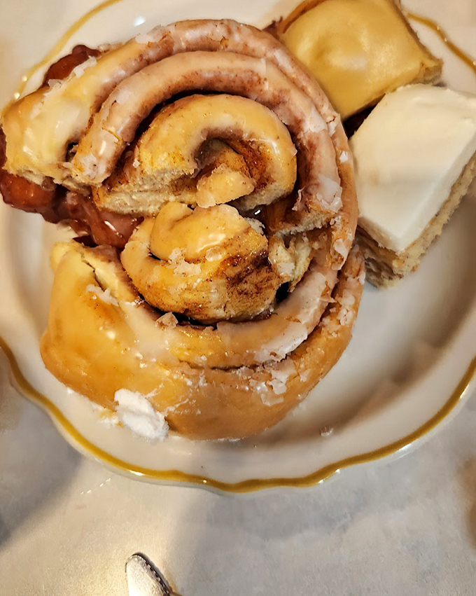 The cinnamon roll that launched a thousand road trips. Spiral-shaped perfection with icing that melts just enough to make you forget all your troubles.