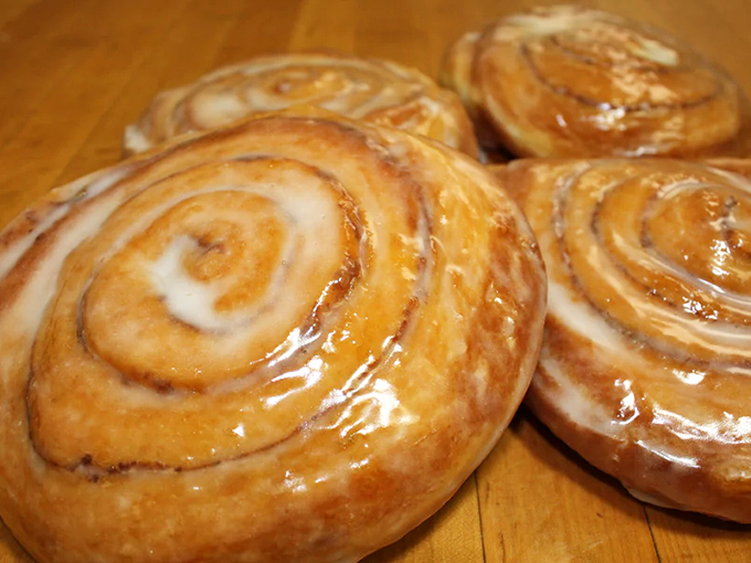 Cinnamon rolls glistening with glaze that would make even the most dedicated dieter whisper, "Worth it." The spiral pattern is practically hypnotic.