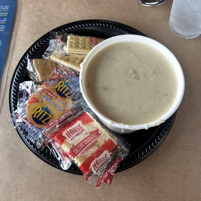 Clam chowder with crackers on the side&mdash;comfort in a cup that warms the soul and prepares the palate for seafood adventures ahead.