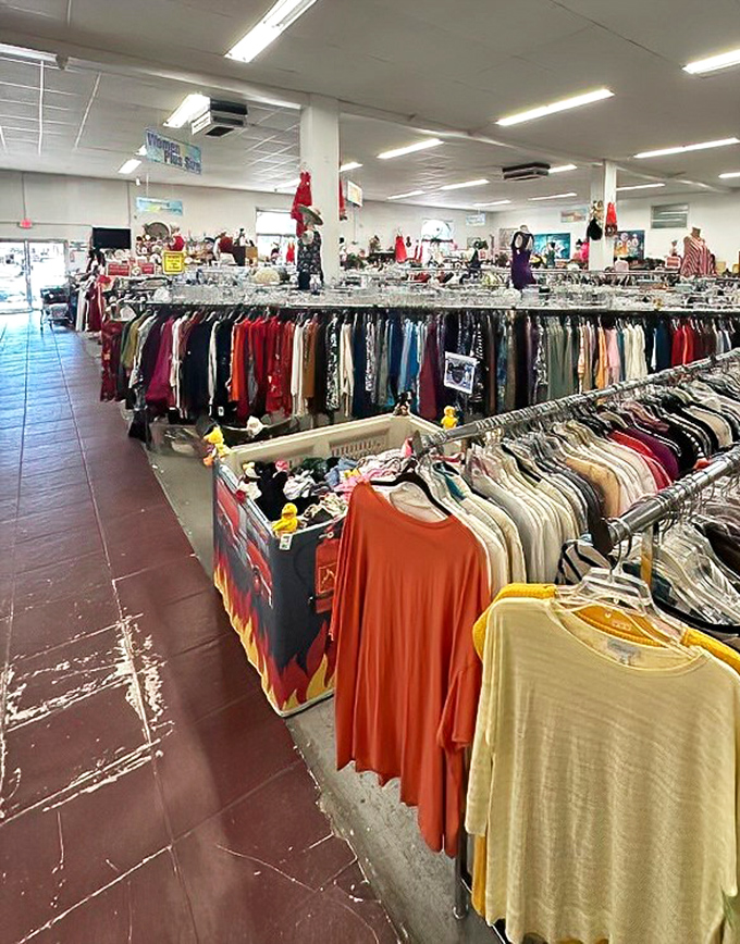 Color-coded clothing racks create a rainbow road of fashion possibilities, where vintage tees mingle with tomorrow's statement pieces.
