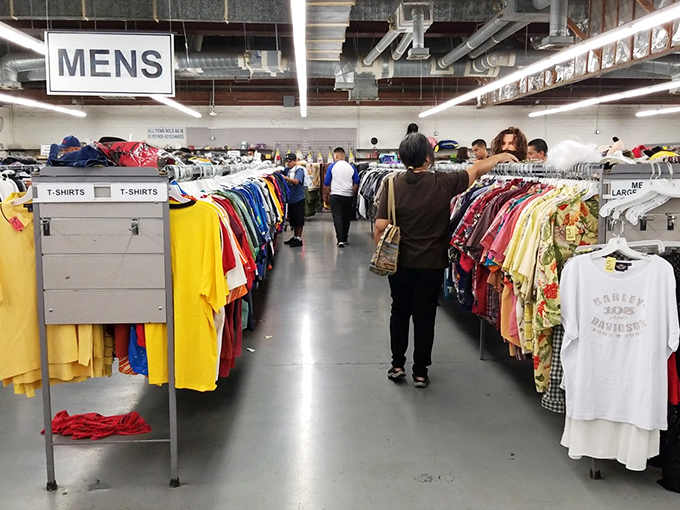 Men's clothing organized with surprising precision. The rainbow of options reminds us that someone else's fashion misstep could be your signature look.