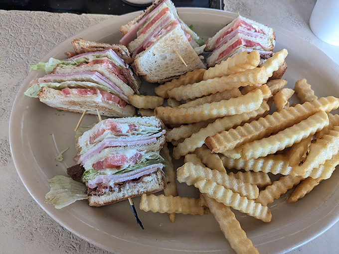 The club sandwich stands tall and proud, like the Washington Monument of lunch options &ndash; layers of deliciousness held together by wooden toothpick engineering.