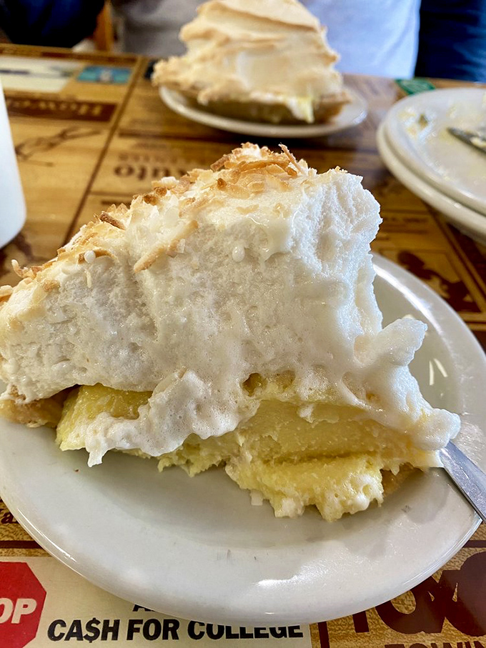 Cloud-like meringue atop coconut cream pie so good it might make you temporarily forget your name. Worth every calorie.