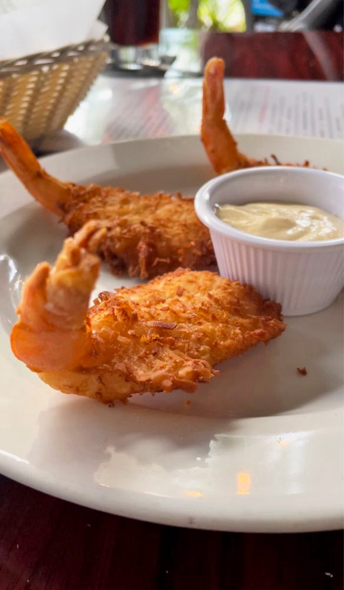 Golden-fried coconut shrimp that crunch like your favorite childhood cereal, but with grown-up flavors that make you glad you aged.