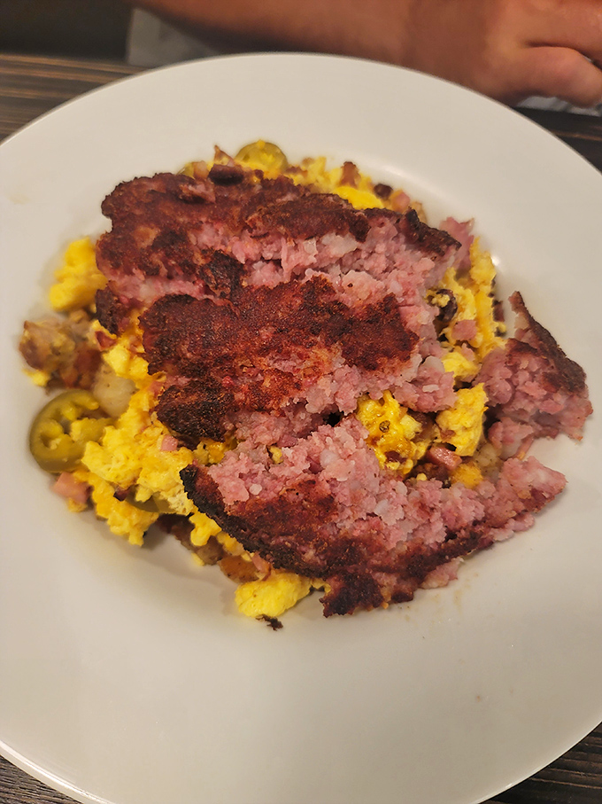 A beautiful mess of corned beef hash and eggs that would make your cardiologist wince and your taste buds sing.