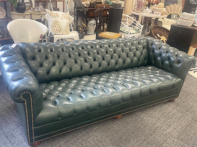 This tufted Chesterfield sofa in British racing green isn't just furniture&mdash;it's a statement piece that whispers, "I have opinions about proper tea."