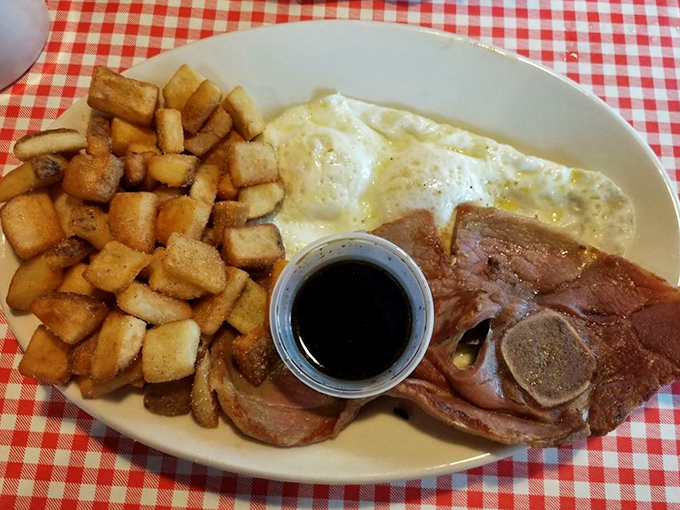 Home fries so perfectly crisp they deserve their own fan club, alongside eggs and country ham that would make any Southern grandmother nod in approval.