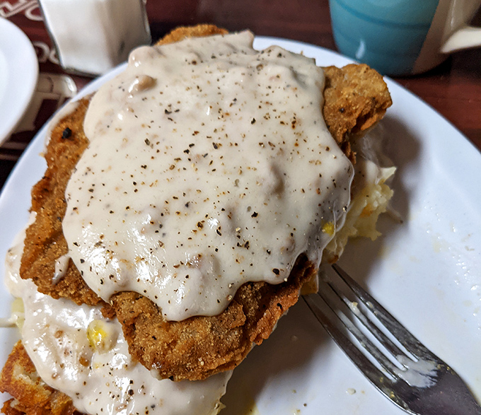 Country fried steak smothered in peppery gravy that could make your grandma jealous. This is comfort food with authority.