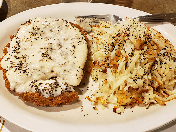 Country fried steak smothered in peppery gravy alongside hash browns that achieved the perfect crisp-to-tender ratio. Comfort food that gives you an actual hug.