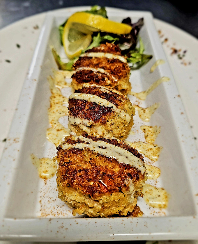 Golden-brown crab cakes that could make a Marylander nod in approval &ndash; crispy exterior giving way to succulent, barely-bound crab treasure.