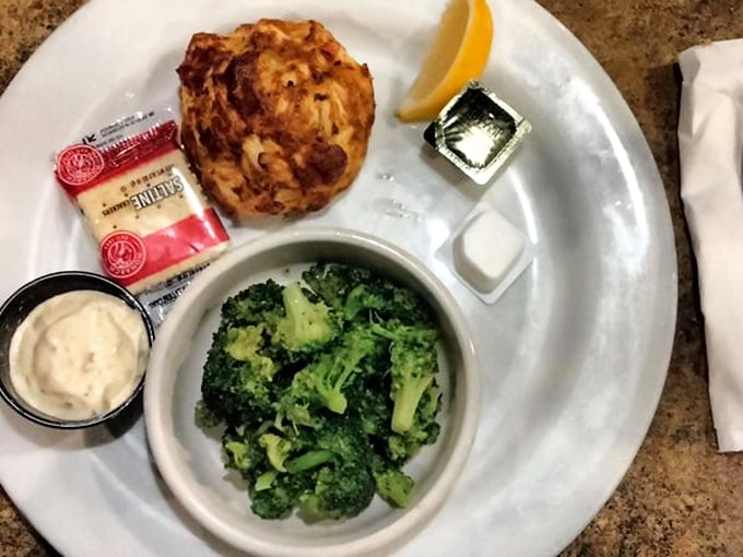 The star of Maryland's culinary universe: a golden-brown crab cake with minimal filler, maximum flavor, and the kind of seafood integrity that makes locals proud.
