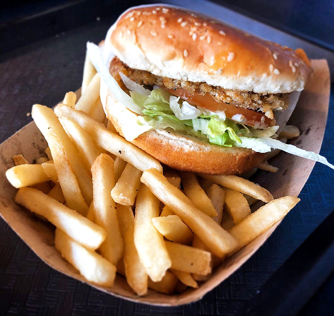 The classic fish sandwich and fries &ndash; proof that sometimes the simplest combinations are culinary poetry in a paper basket.