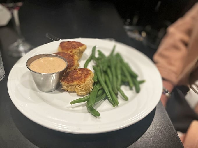 Golden-brown crab cakes with a side of fresh green beans&mdash;proof that seafood can find its perfect expression even in the heartland.