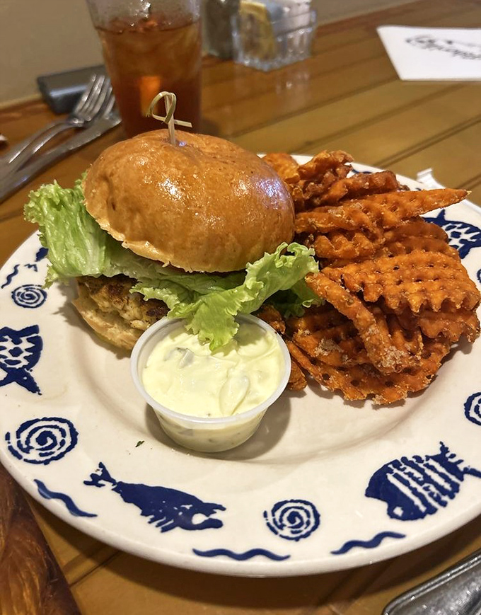 Golden crab cake sandwiches paired with waffle fries prove that comfort food can be absolutely sophisticated.