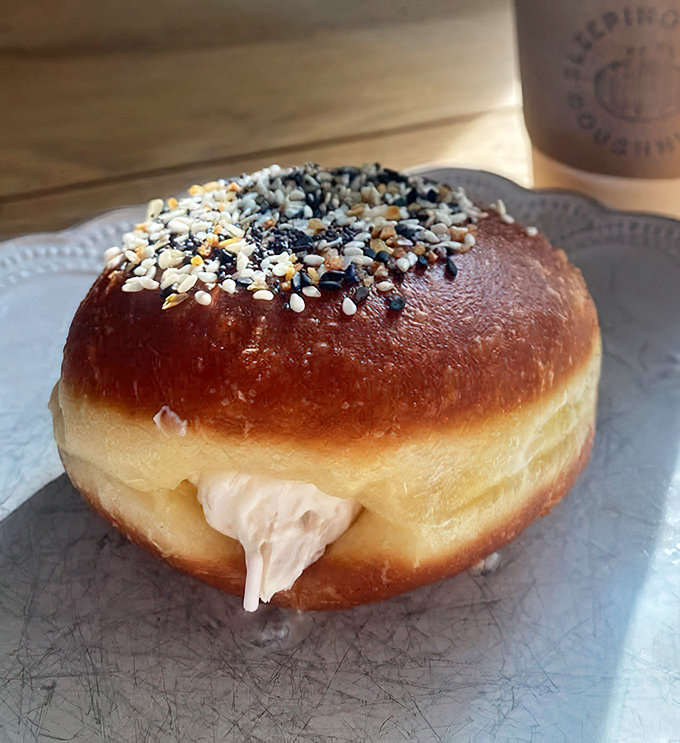Cream-filled perfection that oozes happiness with every single bite - pure breakfast bliss in donut form.