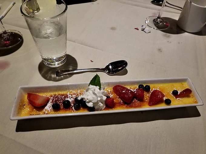 Cr&egrave;me br&ucirc;l&eacute;e with berries: where the crack of caramelized sugar sounds like a standing ovation for your taste buds.