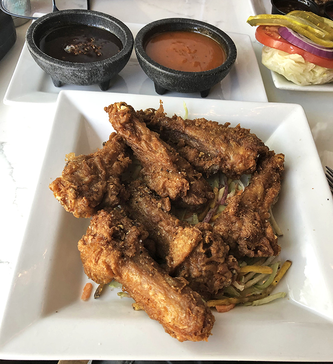 These crispy duck wings aren't messing around. Golden-brown, perfectly seasoned, and served with dipping sauces that mean serious business.