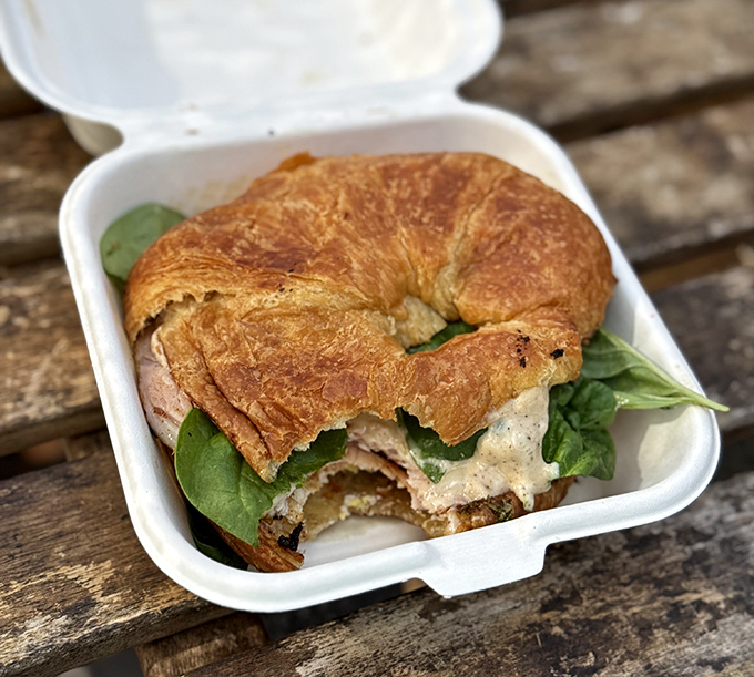 Even French pastry meets American practicality here - a croissant sandwich that manages to be both elegant and satisfyingly messy at the same time.