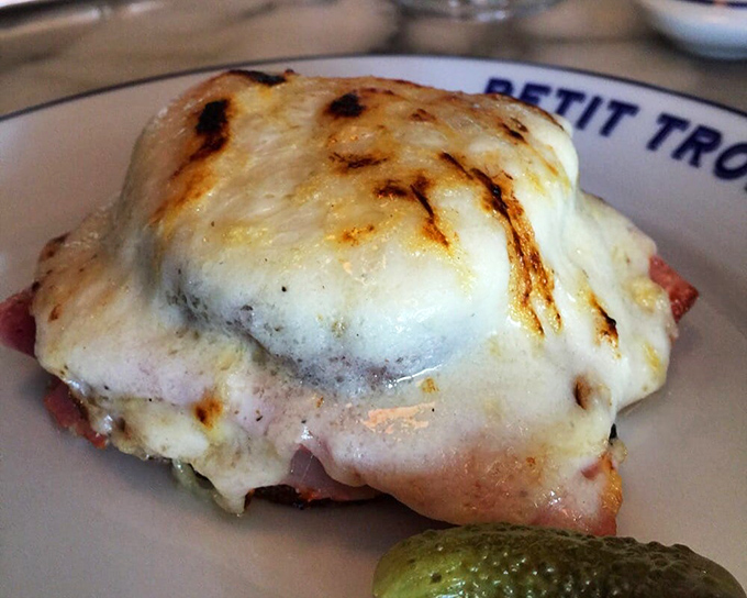 The Croque Monsieur at Petit Trois doesn't just satisfy hunger&mdash;it resolves existential crises. Melted cheese bronzed to perfection atop quality ham makes ordinary sandwiches seem pointless.