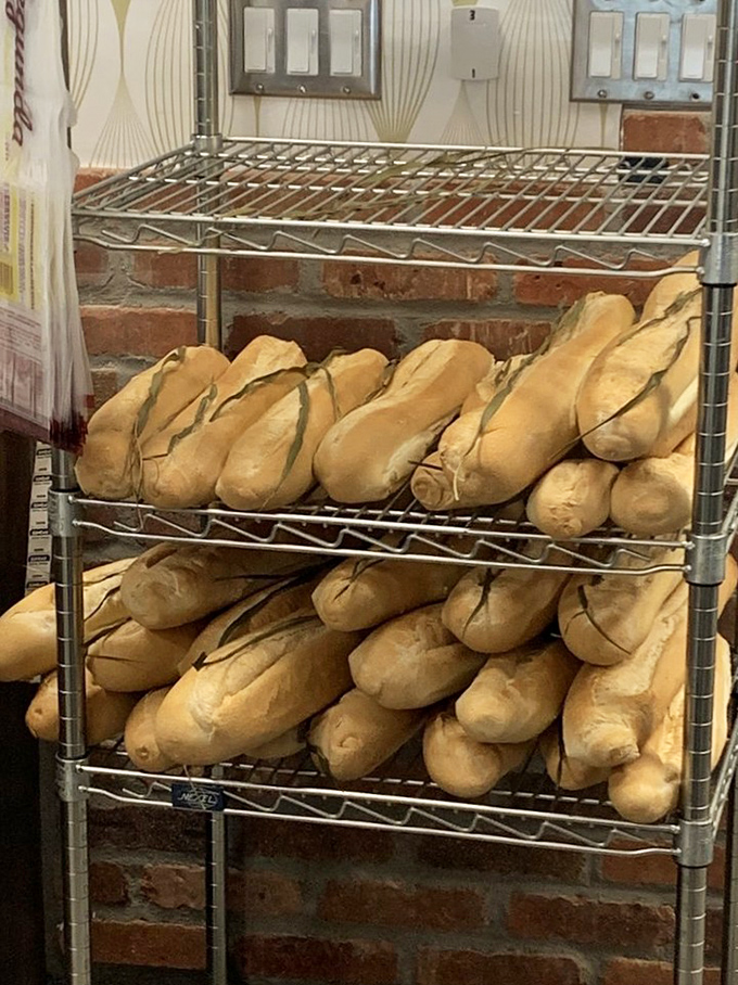 Cuban bread soldiers lined up and ready for duty. That distinctive split down the middle isn't just for show&mdash;it's tradition baked into every loaf.