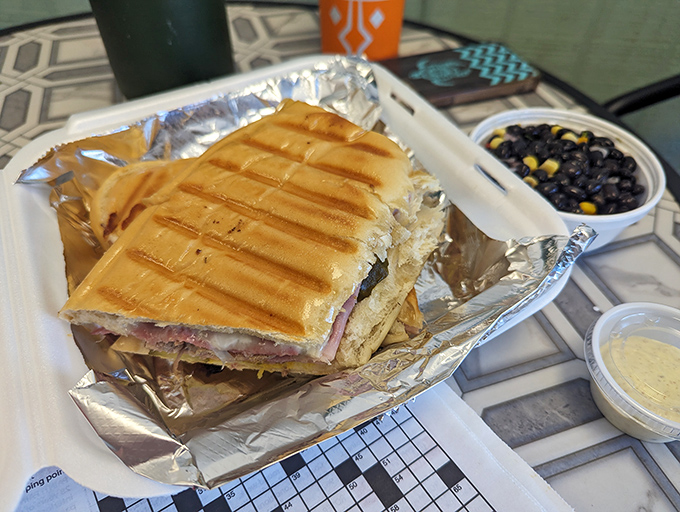 This pressed Cuban sandwich, golden and crispy, comes with black beans that aren't just a side dish&mdash;they're practically their own main event.