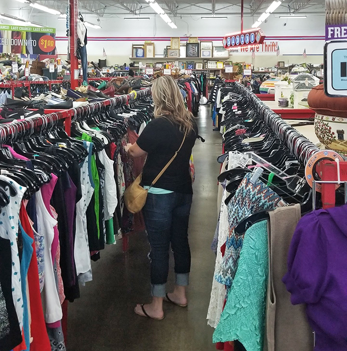 Fellow treasure hunters navigate the aisles with the focused determination of seasoned bargain archaeologists.