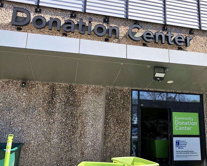 "Donation Center" &ndash; where the thrift circle begins. These bright green bins eagerly await their next cargo of pre-loved possibilities.