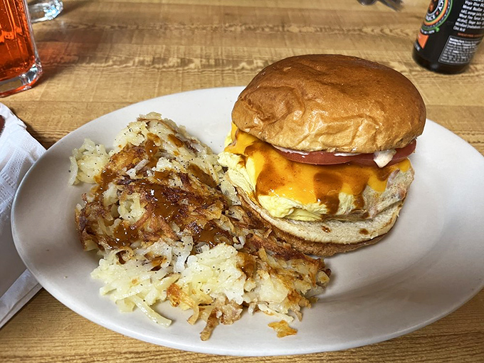 The breakfast sandwich that makes Monday mornings bearable—golden egg, melty cheese, and perfectly browned hash browns that crunch with each bite.