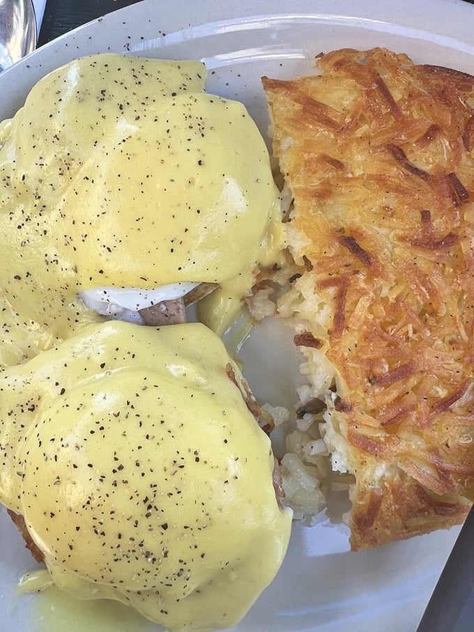 Eggs Benedict that would make the Pope jealous. Those hash browns deserve their own fan club&mdash;crispy exterior, tender interior, and seasoned with what can only be described as breakfast magic.