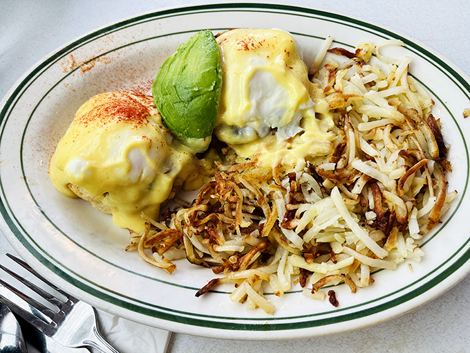 Eggs Benedict with avocado: where breakfast meets California. Those hash browns are doing exactly what hash browns are supposed to do&mdash;stealing the show.