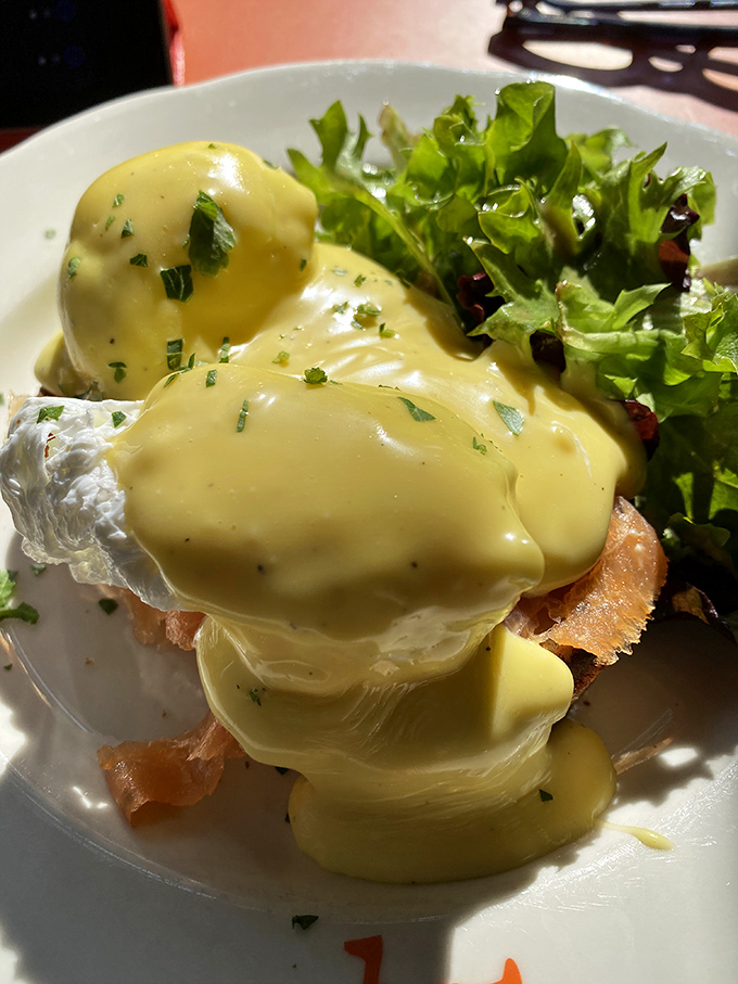 Hollandaise sauce cascading like a golden waterfall over perfectly poached eggs. Breakfast doesn't get more luxurious than this.