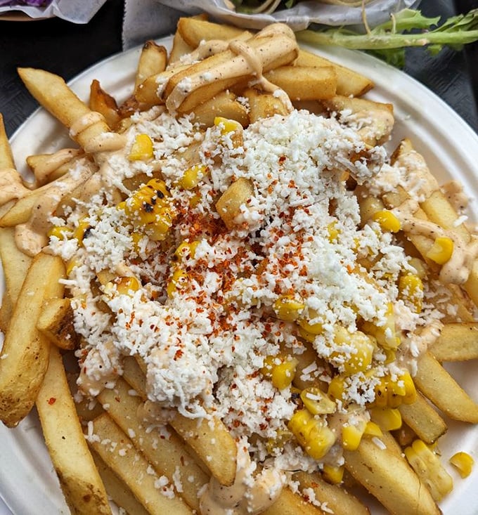 Elote fries: Where street corn met French fries and decided to throw a fiesta with queso fresco and a sprinkle of chile.