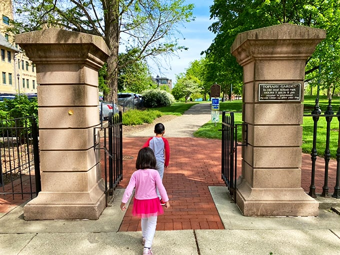Grand entrance, humble invitation. These stately stone pillars welcome visitors of all ages to step into a world where art and nature become best friends.
