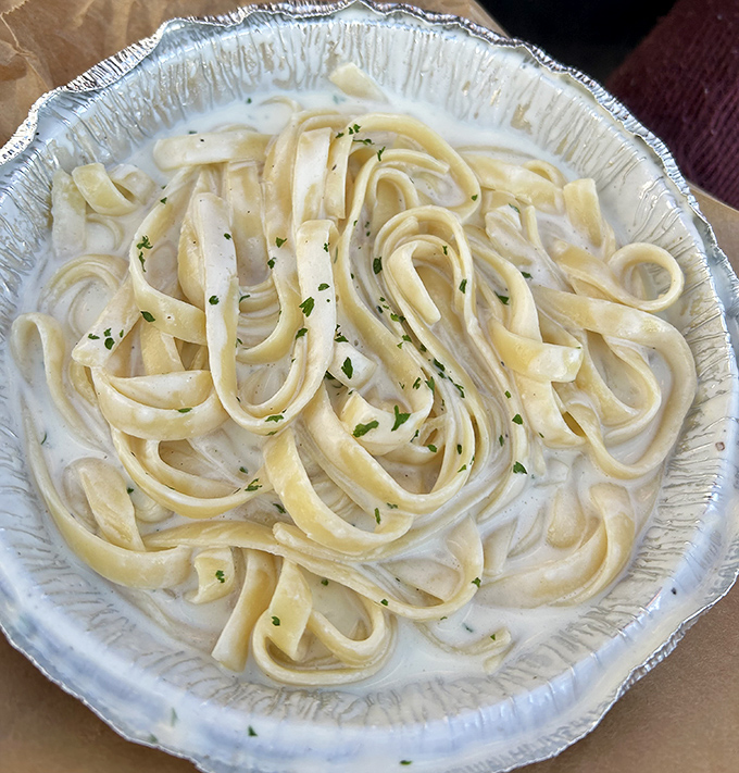 Fettuccine Alfredo so creamy it should come with a warning label: "May induce spontaneous sighs of contentment."