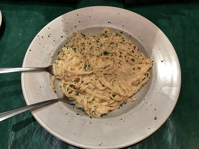 Fettuccine Alfredo so perfectly executed it makes you wonder if there's an Italian grandmother hidden somewhere in the kitchen guarding her secrets.