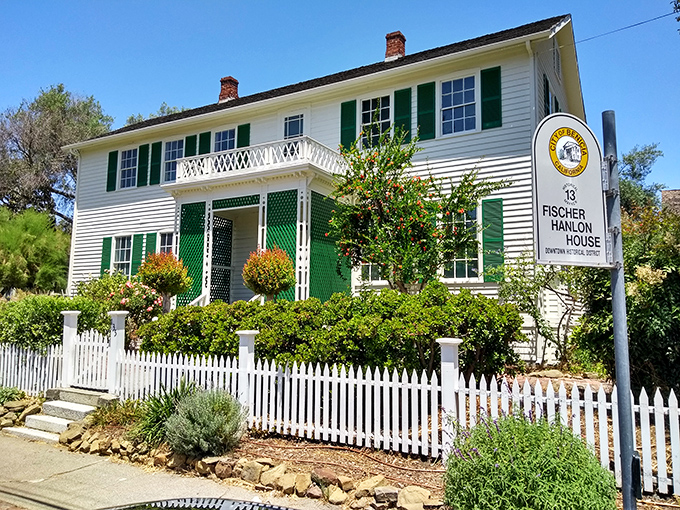 The Fischer-Hanlon House stands as a picture-perfect example of Victorian architecture, complete with the white picket fence that Norman Rockwell would have sketched.