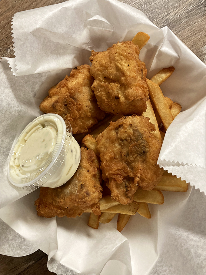 Golden-fried fish nestled against hand-cut fries. Simplicity perfected is worth more than a thousand fancy foams and reductions.