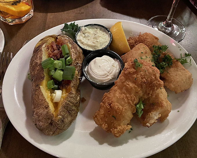 A loaded baked potato meets crispy fish – the Wisconsin dinner duet that proves paradise exists at the intersection of land and lake.