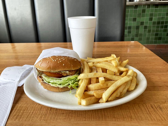 This isn't just a burger&mdash;it's architectural brilliance with layers of fresh vegetables, perfectly melted cheese, and a bun that knows its supporting role.