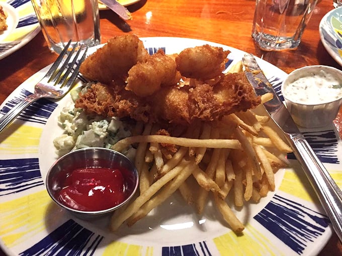 Golden-battered fish that shatters with each bite, paired with fries so perfect they deserve their own fan club.