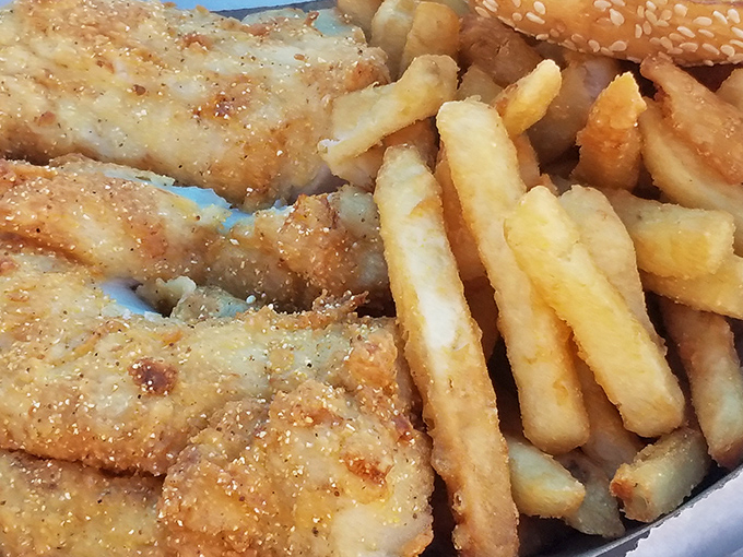 Fish and chips so perfectly golden they deserve their own Olympic medal. The crispy exterior gives way to flaky white fish that tastes like the ocean itself.