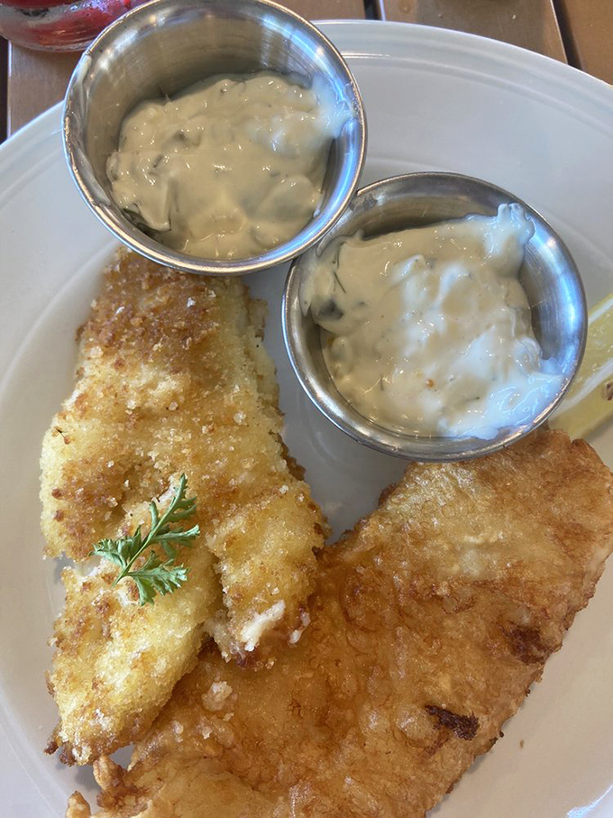 Golden-fried perfection meets creamy tartar sauce. This fish isn't just fresh&mdash;it probably was swimming this morning before volunteering for dinner duty.