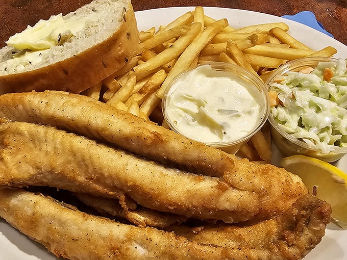 Golden-battered perch served with the holy trinity of Wisconsin sides&mdash;french fries, coleslaw, and a slice of buttery garlic bread. Friday night perfection.