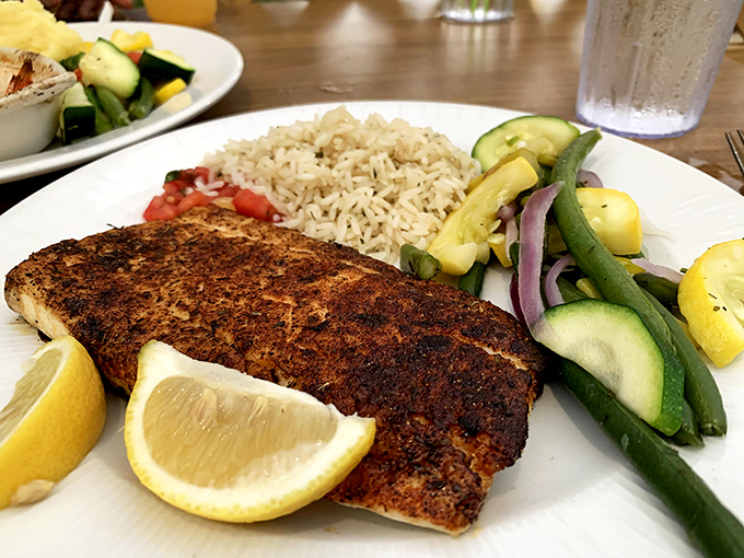Blackened perfection meets colorful companions&mdash;this fish doesn't need a passport to take your taste buds on a vacation.