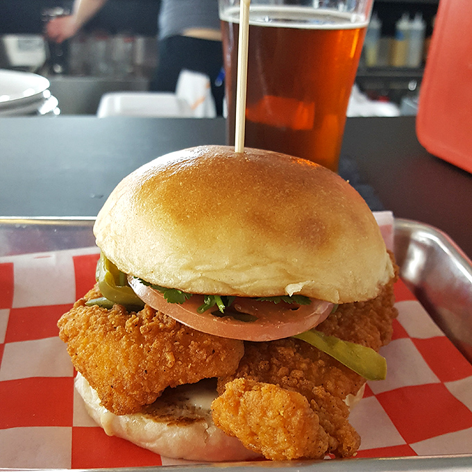 Golden-fried perfection meets fluffy brioche—this fish sandwich doesn't just swim in the same pond as the burgers, it makes its own splash.