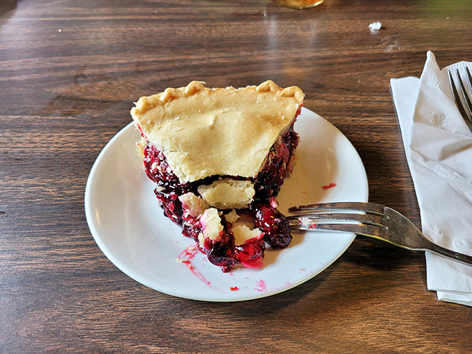 Berry pie so good it should come with a warning label. That flaky crust is holding back a flavor explosion that could change your life. 