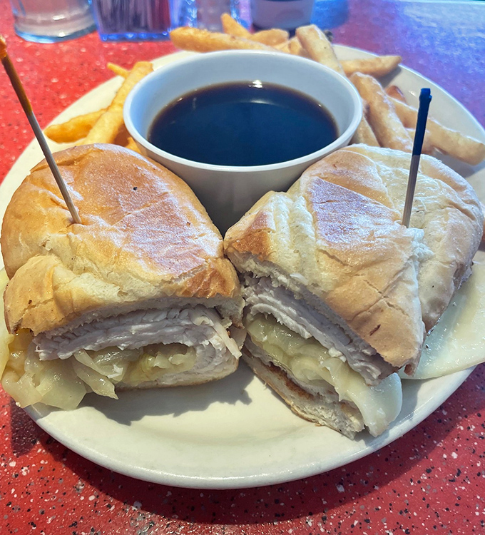 French dip sandwich with au jus that could make even the most devoted barbecue fan reconsider loyalties.