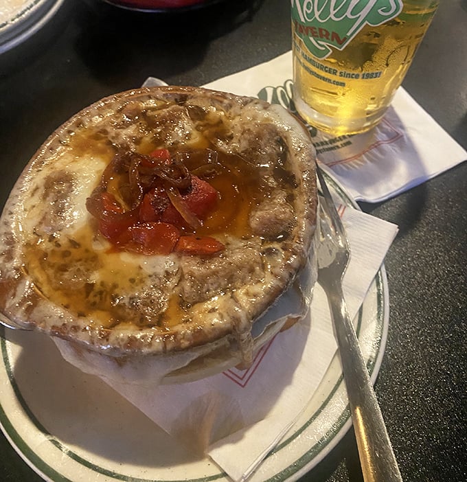 French onion soup that doesn't just warm your body but your soul. That bubbling cheese cap is like a cozy blanket tucking in all the savory goodness below.